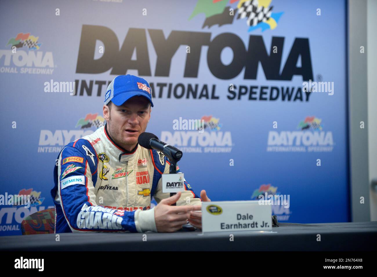 Dale Earnhardt Jr. answers a question during a news conference before a ...