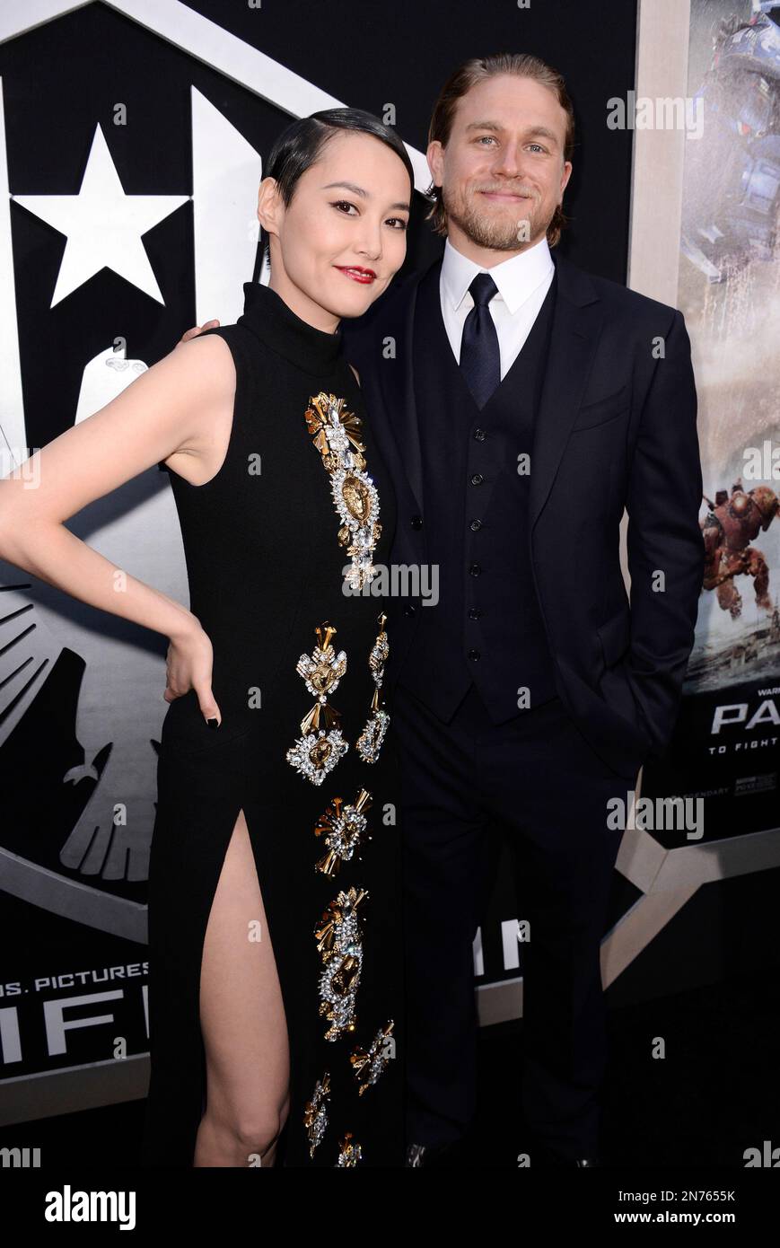 Actress Rinko Kikuchi, left, and actor Charlie Hunnam arrive on the red ...