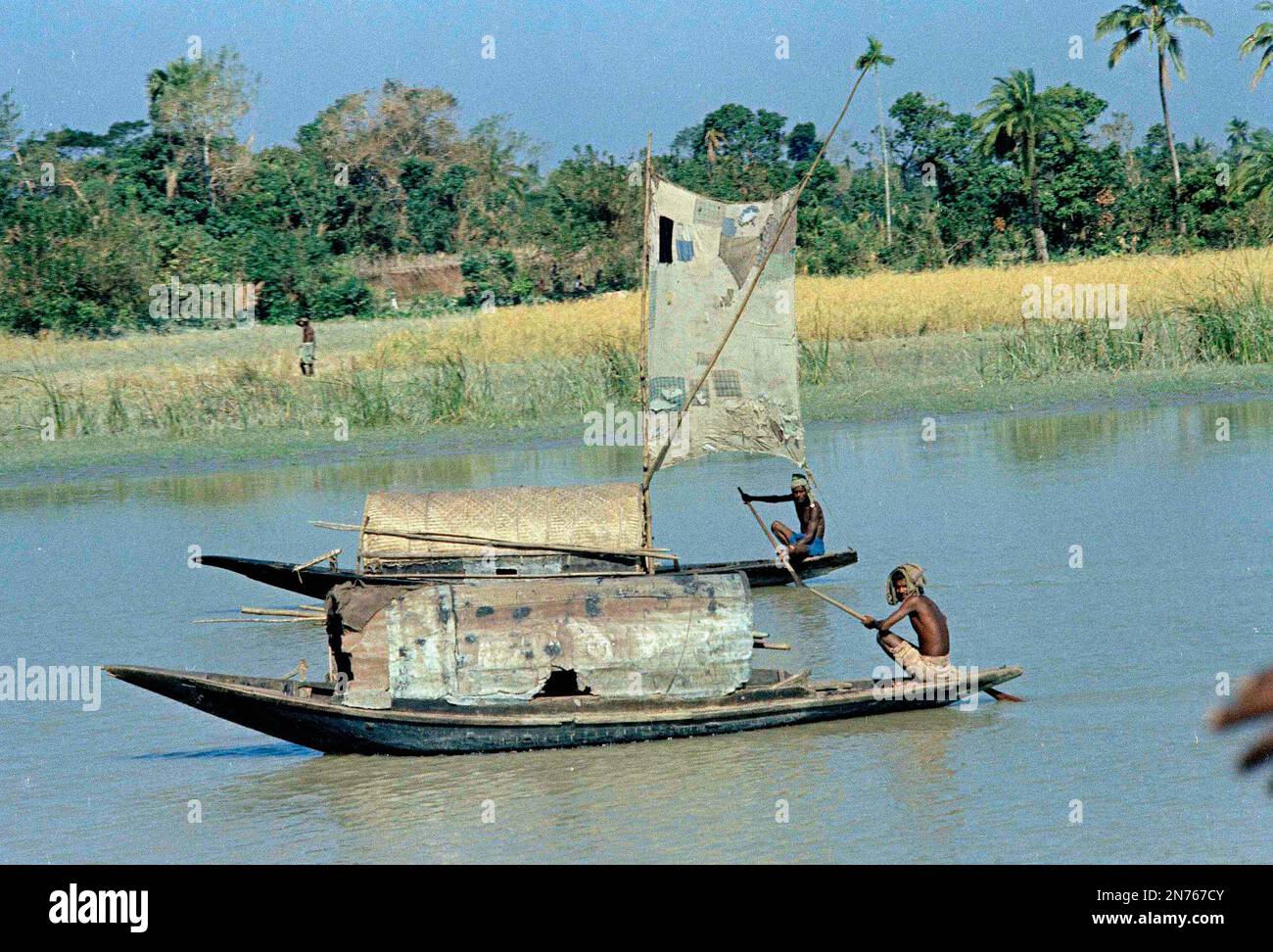 People of Bhola fish near what remains of their homes following the ...