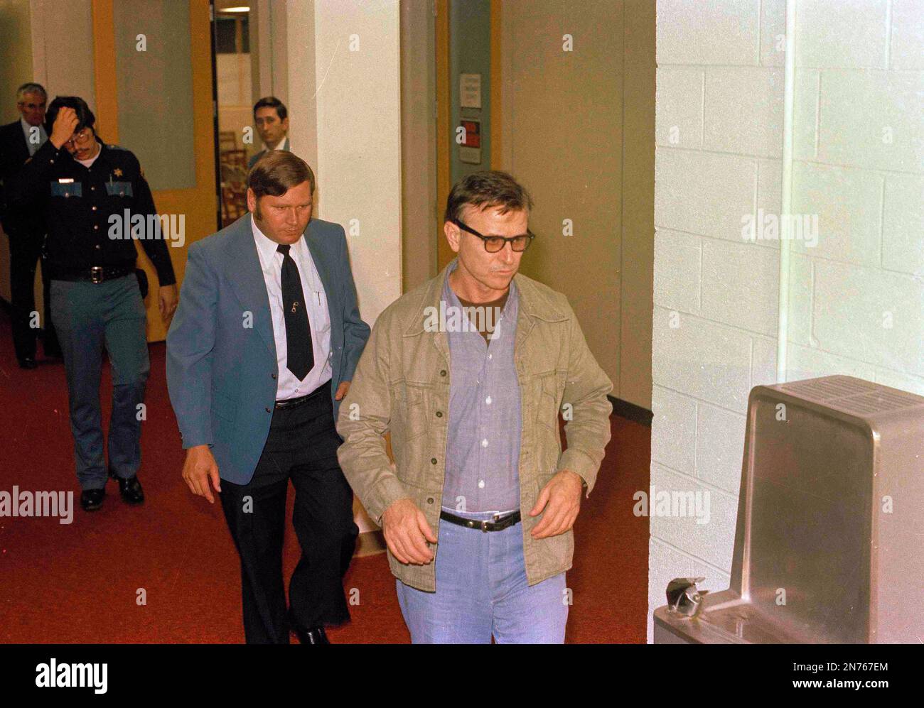 James Earl Ray, wearing jacket and tie, is shown at his escape trial in ...