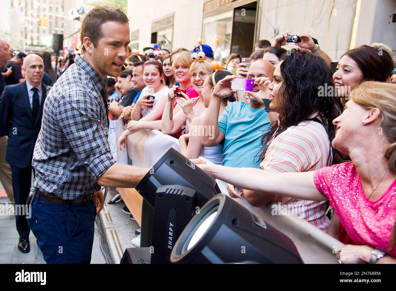 Ryan Reynolds meets with fans during a promotional segment for the ...