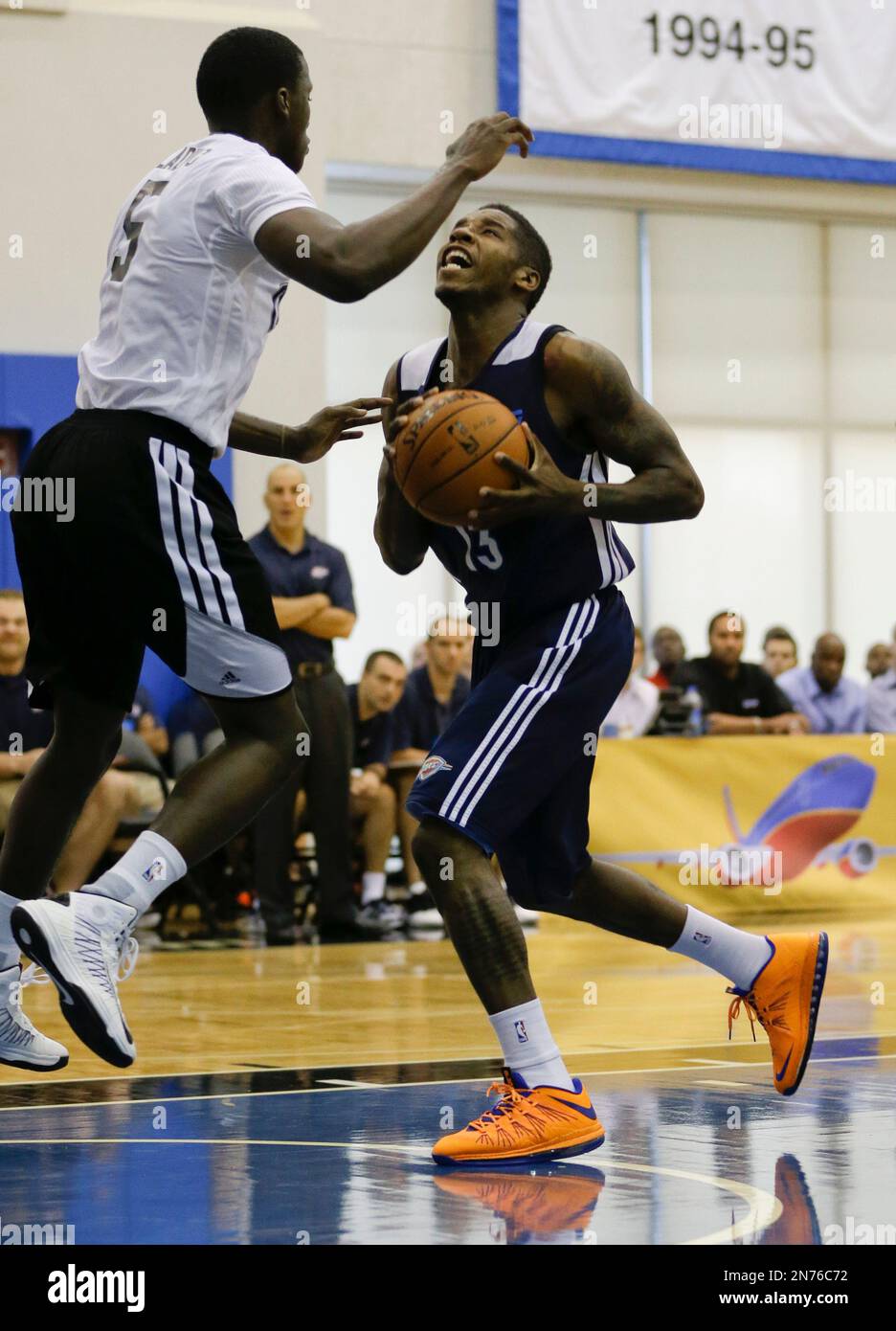 Oklahoma City Thunder's Dwight Bucks, right, goes up for a shot against ...