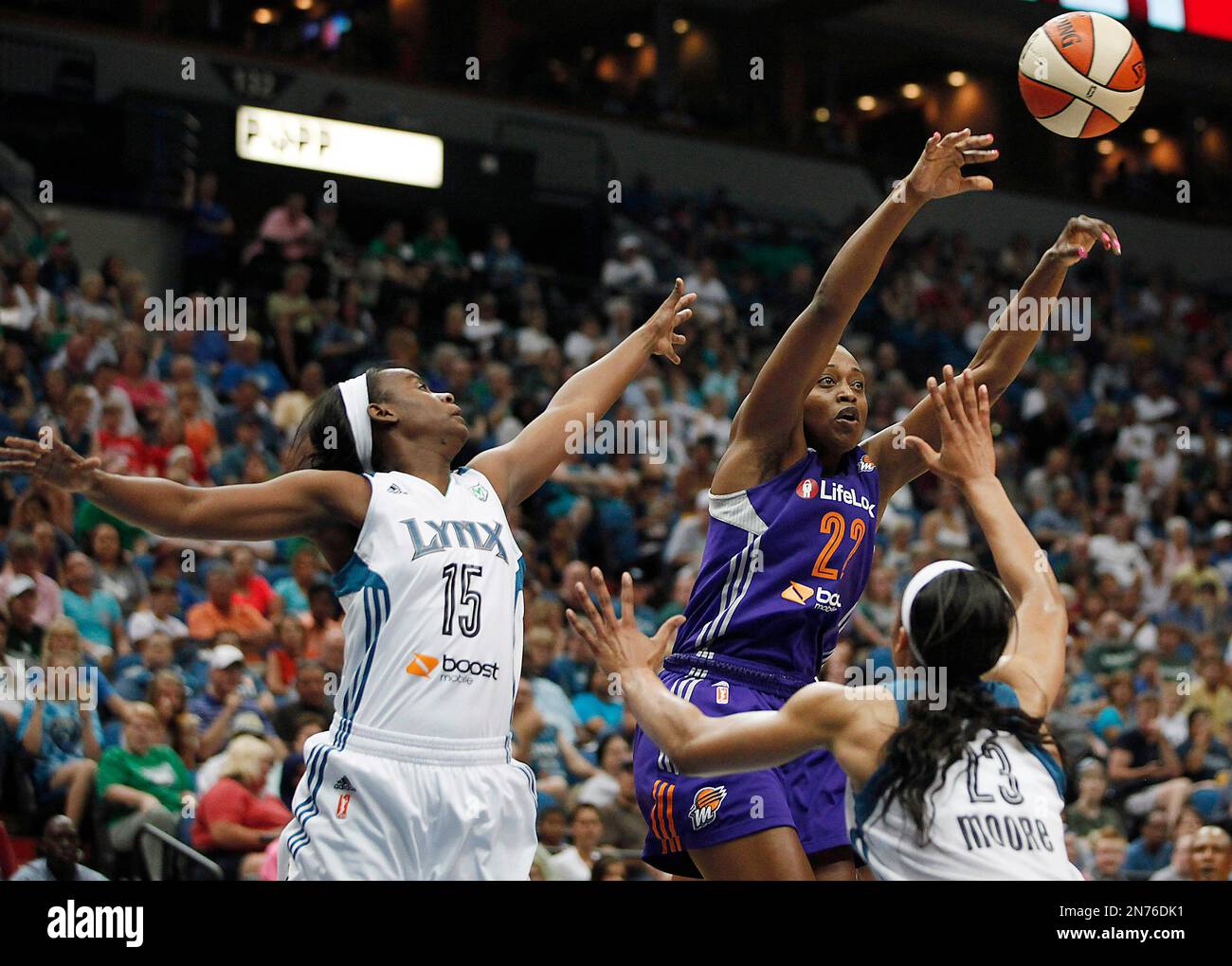 Phoenix Mercury forward Charde Houston (22) passes the ball away from ...
