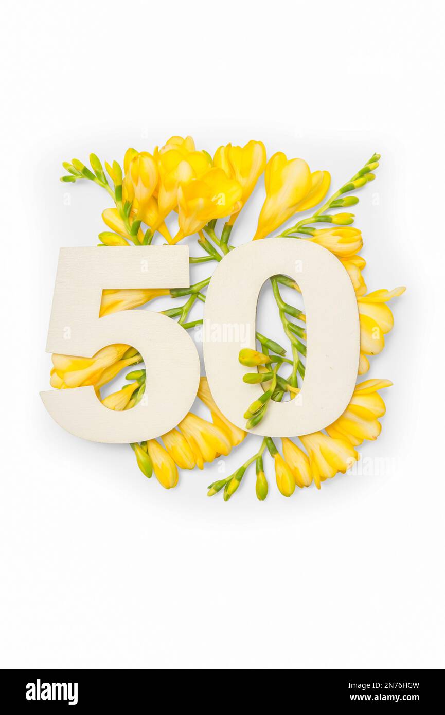 Number fifty shape with brunch of yellow freesia flower isolated over ...