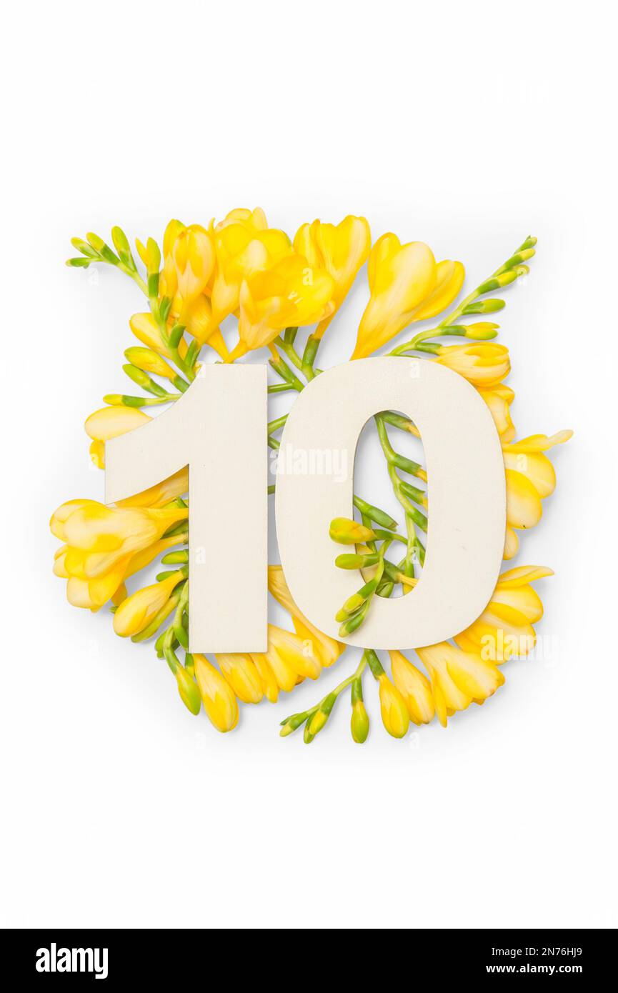 Number ten shape with brunch of yellow freesia flower isolated over ...