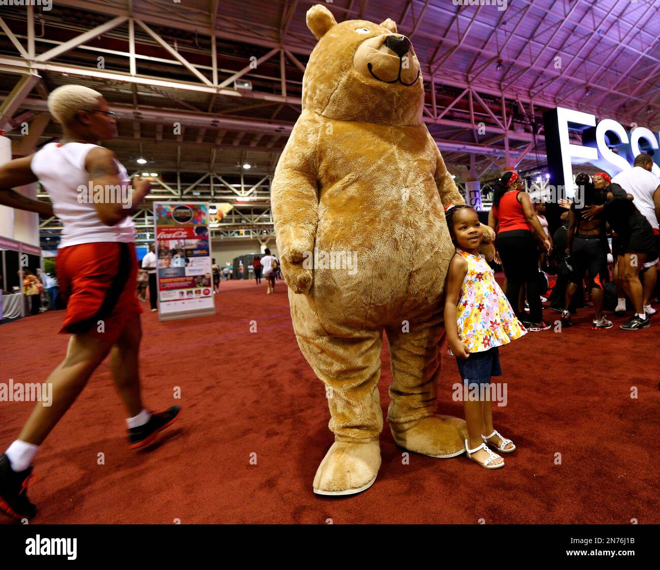 Four-year-old Derrica Cooleyon poses with the Charmin Bear during ...