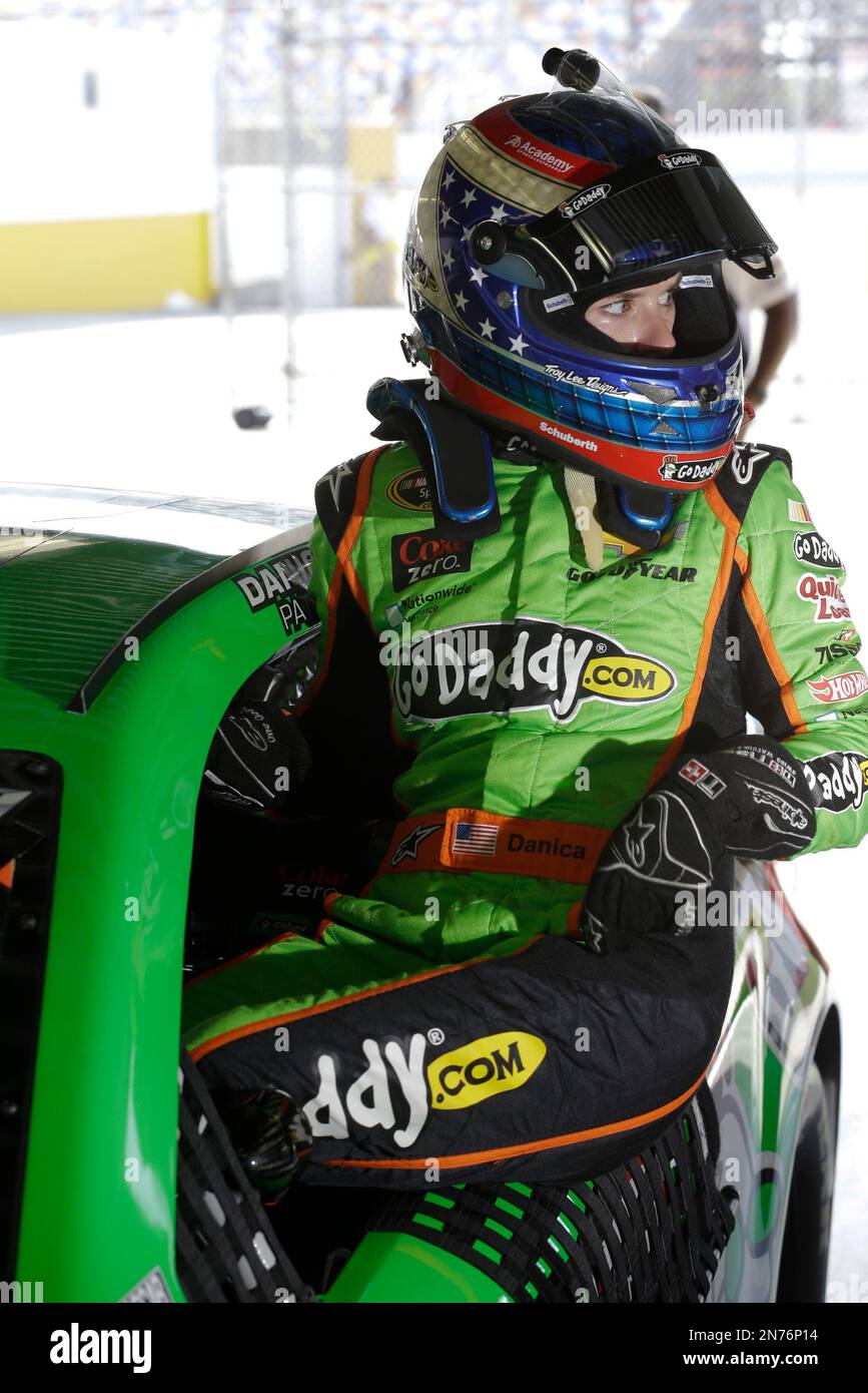 Danica Patrick climbs out of her car after her qualifying run for ...