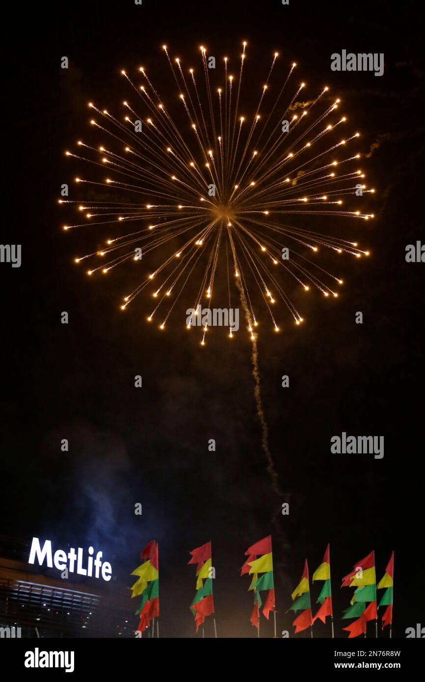 Fireworks explode over flags at State Fair Meadowlands and the sign at ...