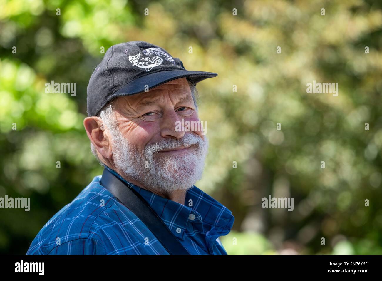 Seattle, Washington, USA. Portrait of a 75 year old man outside wearing ...