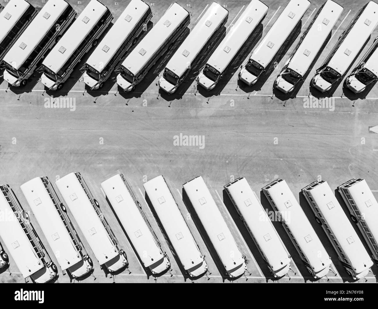 An aerial view of rows of buses parked in the parking lot Stock Photo ...