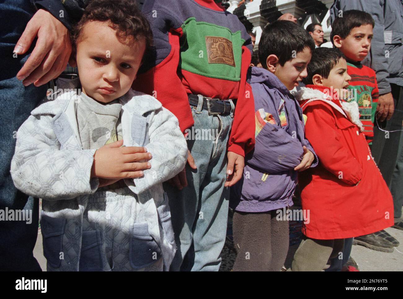Jordanian children pray at a mosque in downtown Amman during Friday ...