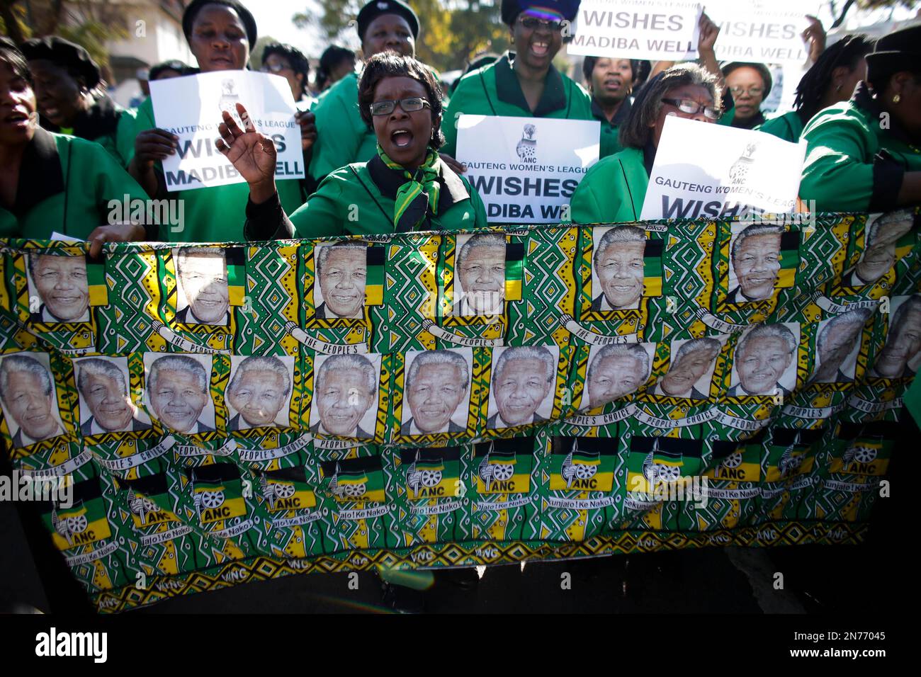 Women of the ANC women league sing and hold posters in support of ...