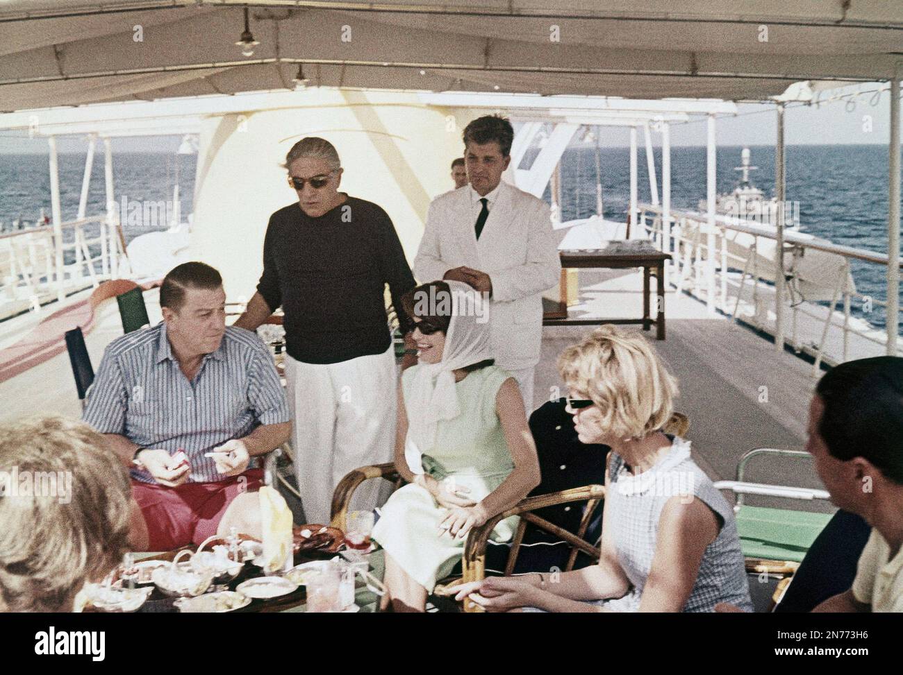 FILE - This is a 1963 file photo of Aristotle Onassis, standing with ...