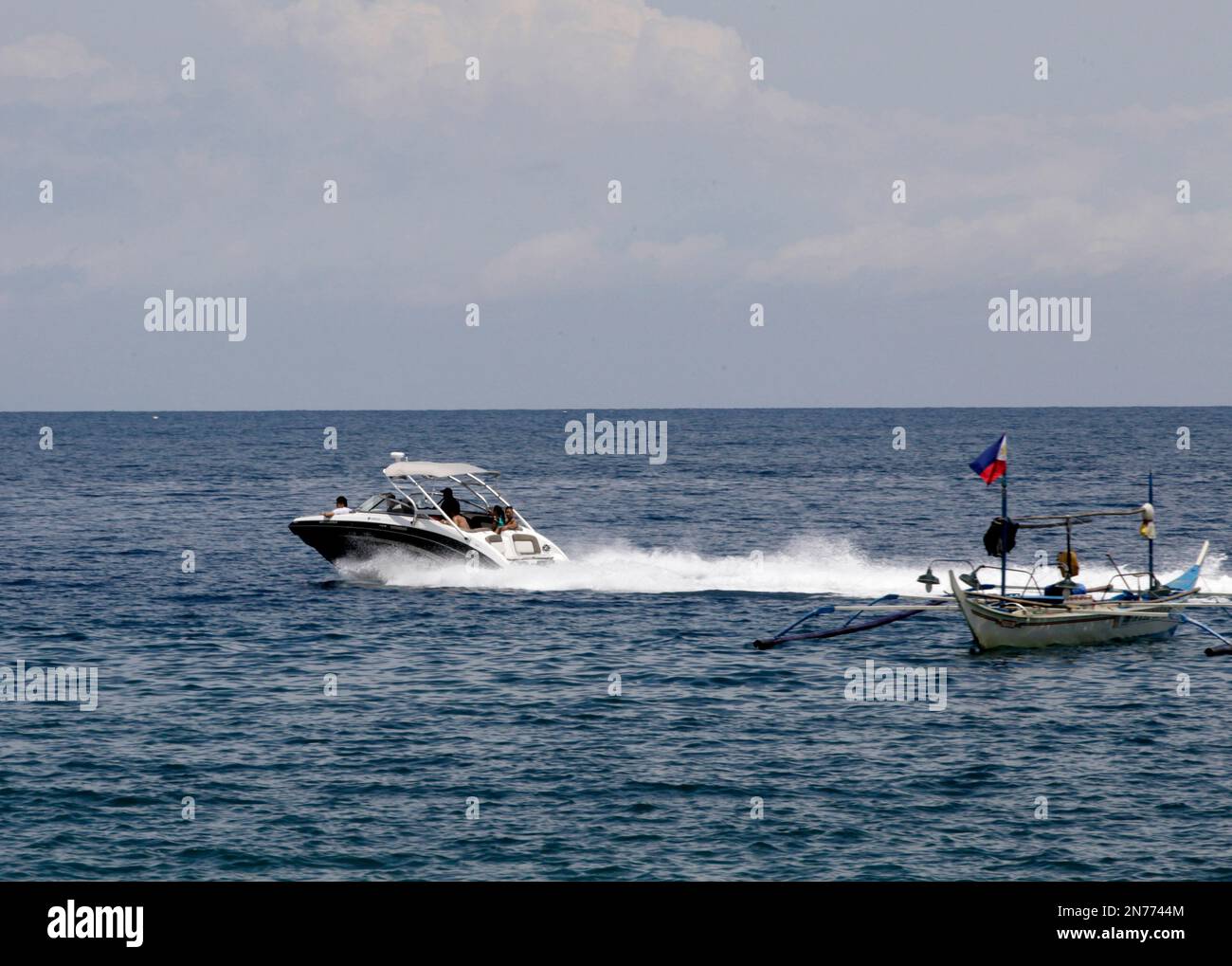 In this April 21, 2013 photo, a luxury speed boat speeds past an ...