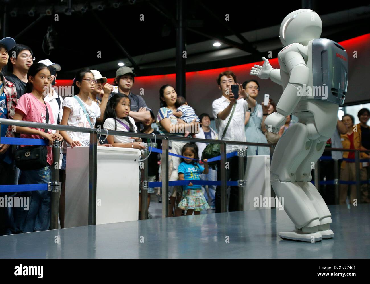 Honda Motor Co.’s interactive robot Asimo gestures while talking with ...