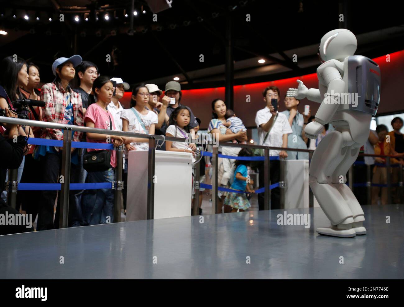 Honda Motor Co.’s interactive robot Asimo gestures while talking with ...