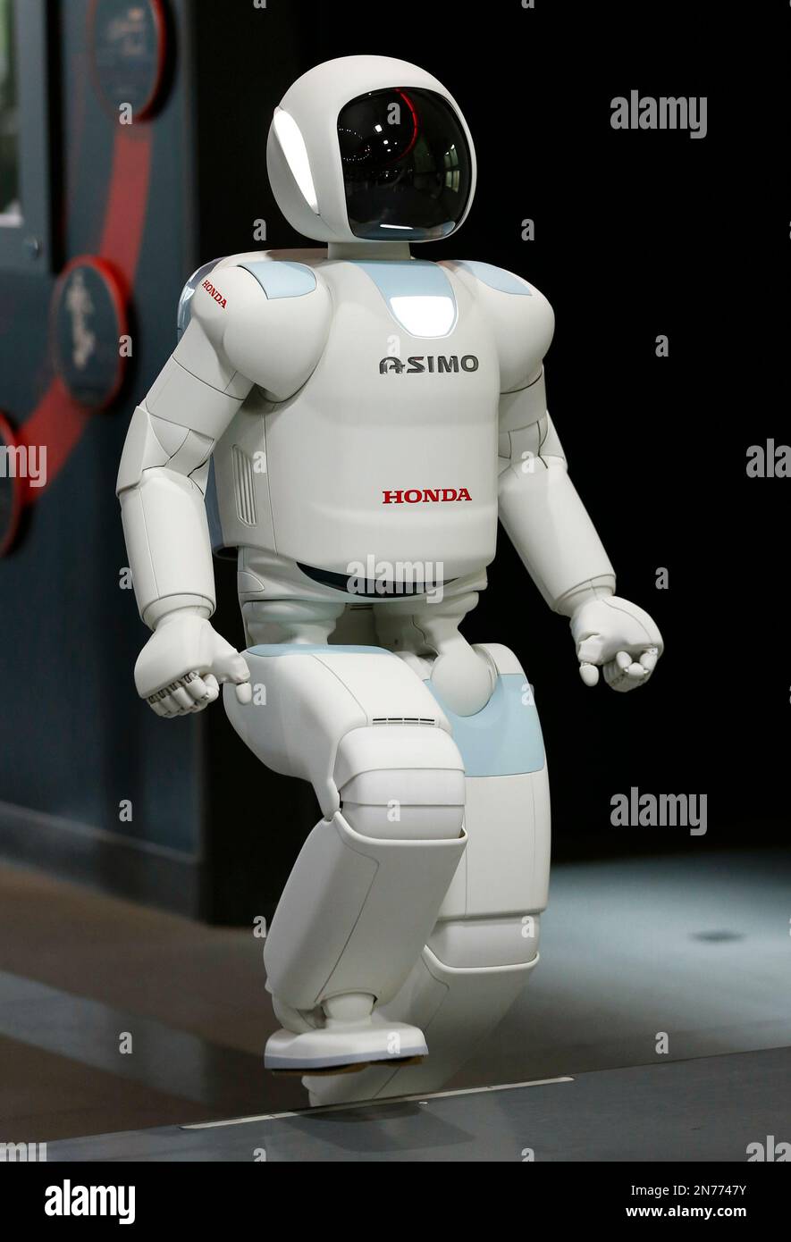 Honda Motor Co.’s interactive robot Asimo walks up a set of stairs ...