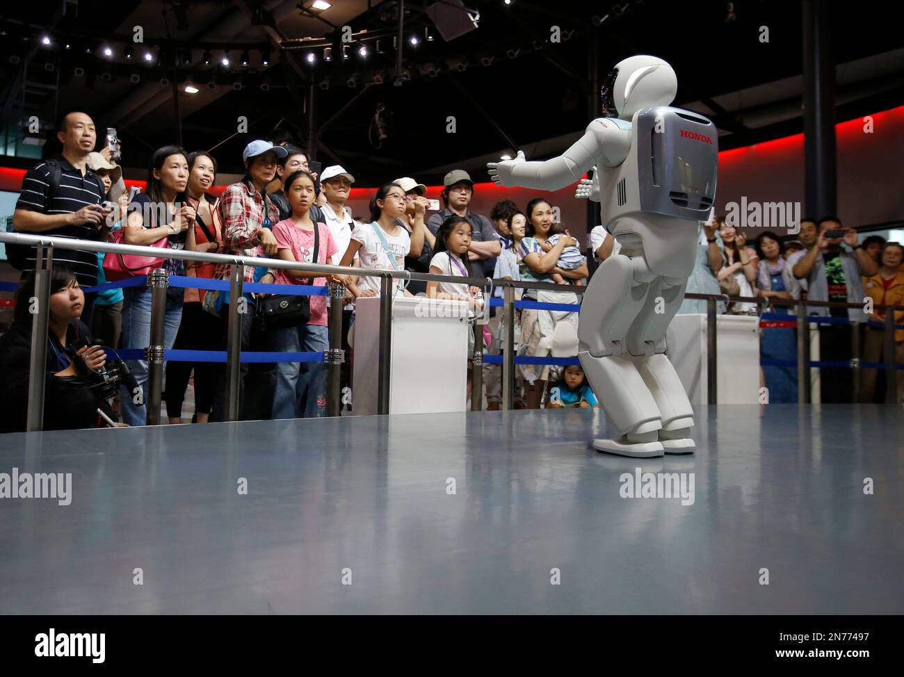 Honda Motor Co.’s interactive robot Asimo gestures while talking with ...