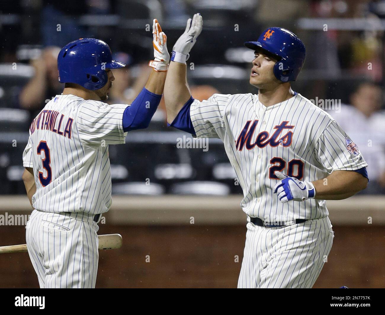 New York Mets' Anthony Recker (20) celebrates with teammate Omar ...