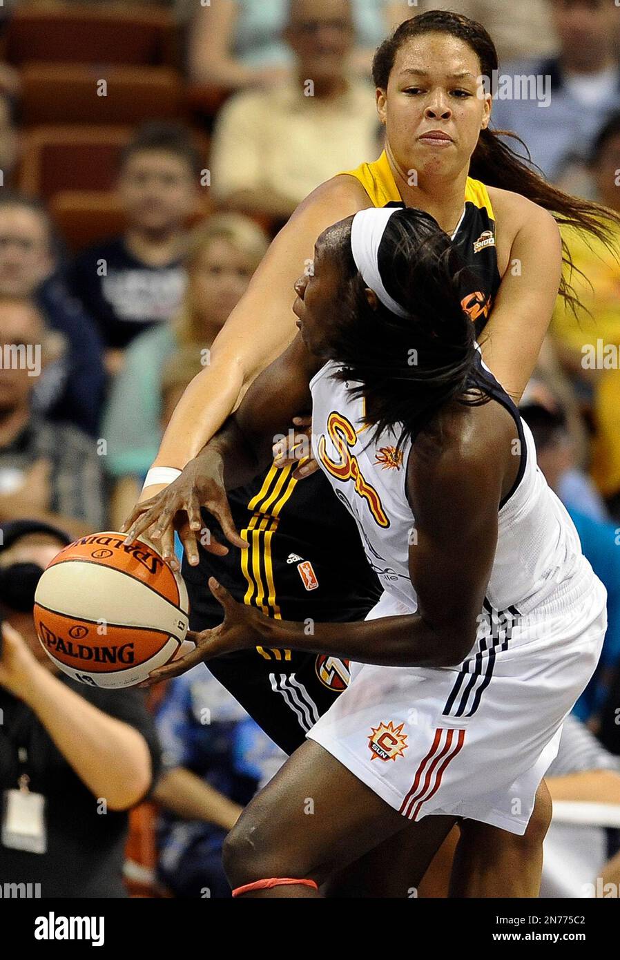 Tulsa Shock's Elizabeth Cambage, top, knocks the ball from Connecticut ...