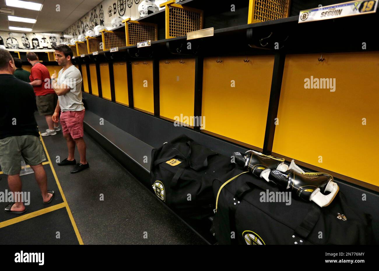 Boston Bruins center Patrice Bergeron gestures towards his right ...