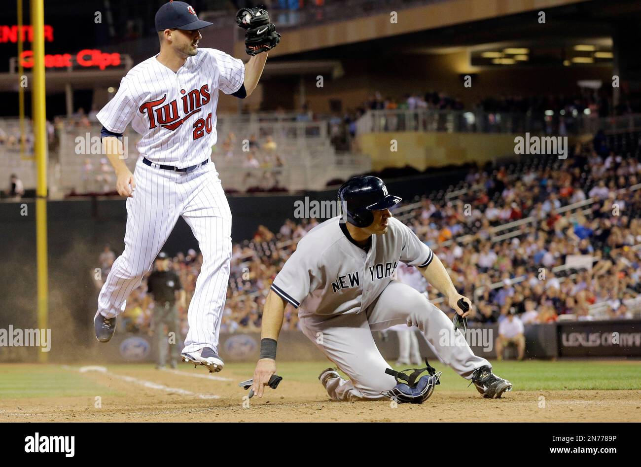 New York Yankees' Travis Hafner, right, beats the tag by pitcher ...
