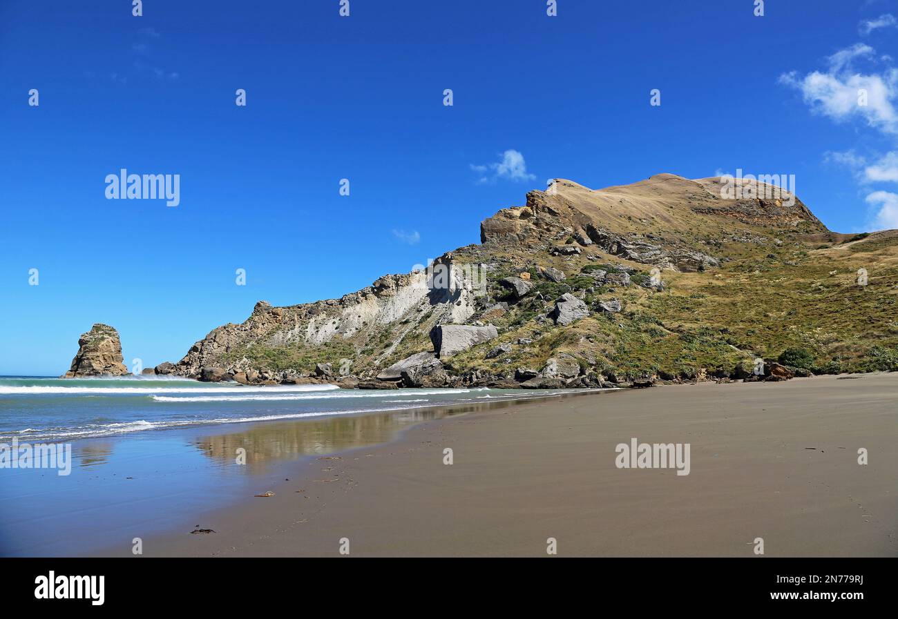 Castle Rock on blue sky - Castlepoint - New Zealand Stock Photo - Alamy