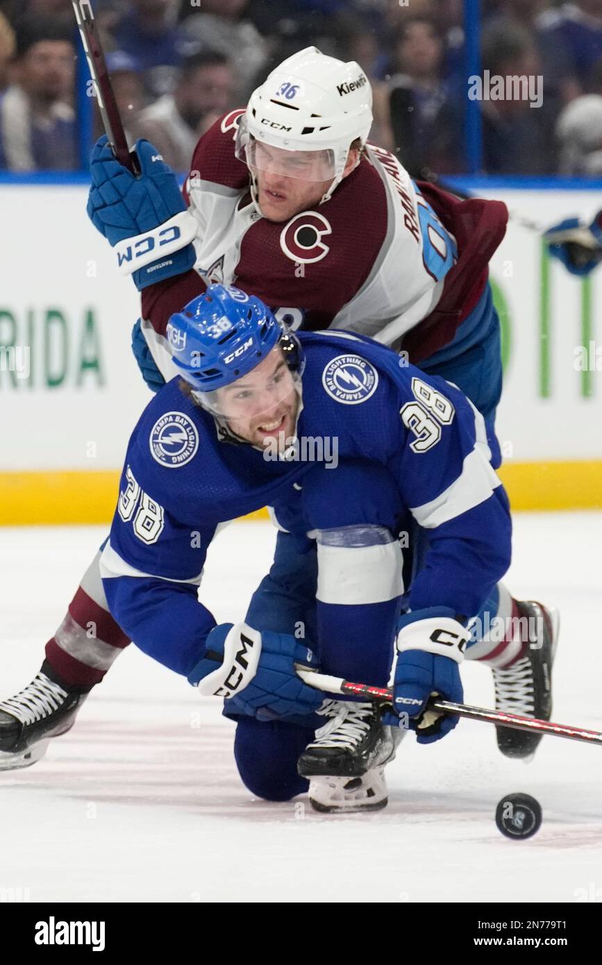 Tampa Bay Lightning left wing Brandon Hagel (38) is taken down by ...