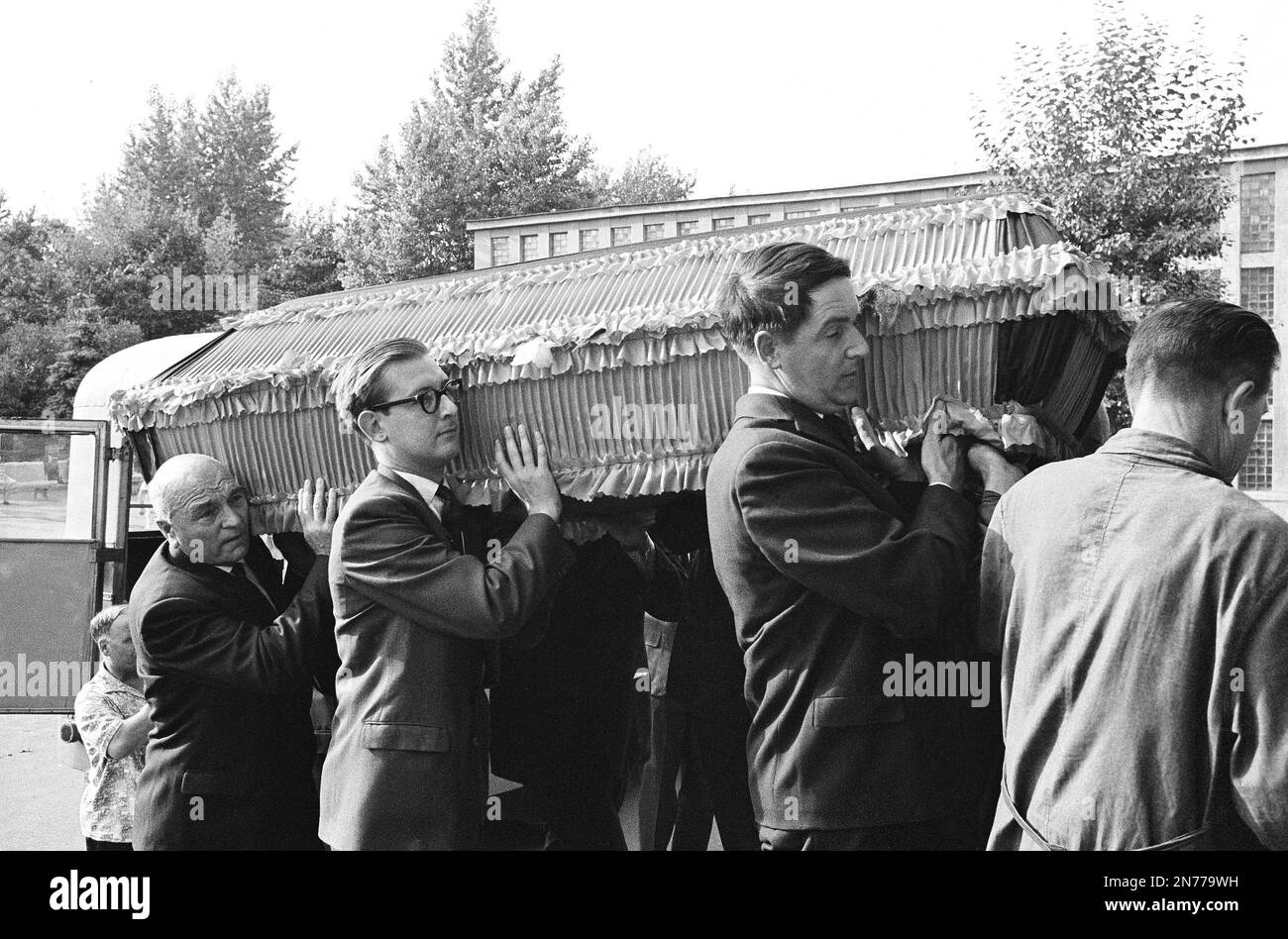 Mourners carry the coffin into the crematorium in Moscow, Sept. 4, 1963 ...