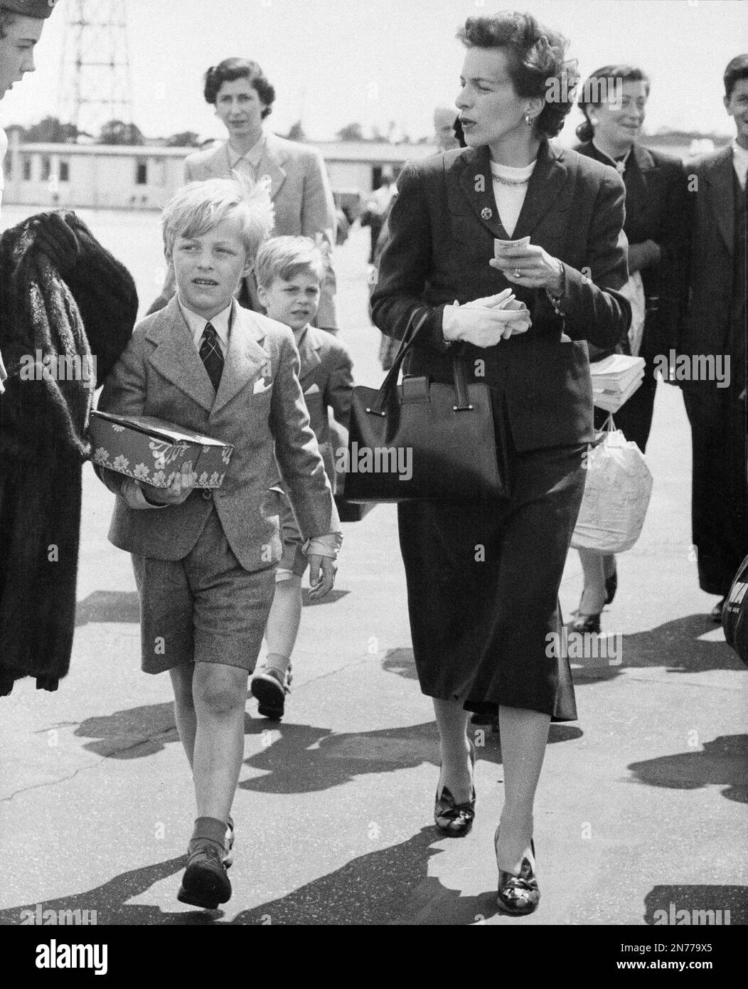 Mrs. Donald MacLean is shown leaving London for France, July 20, 1952 ...