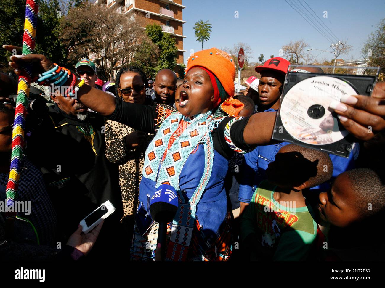 Jessica Mbangeni, performs a poem for former South African President ...