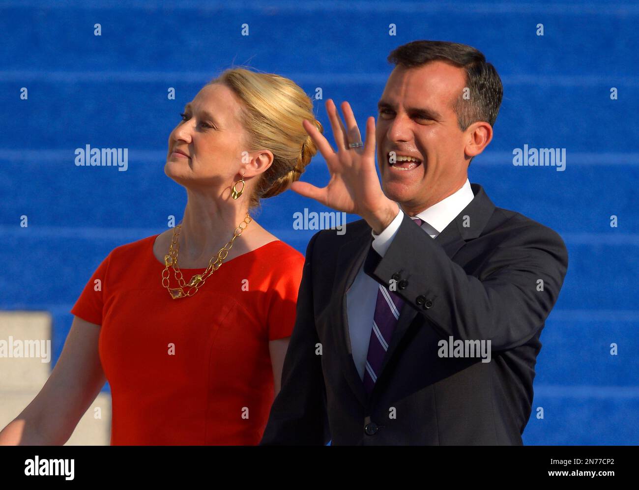 Eric Garcetti, right, waves as his wife Amy Wakeland looks on as they ...