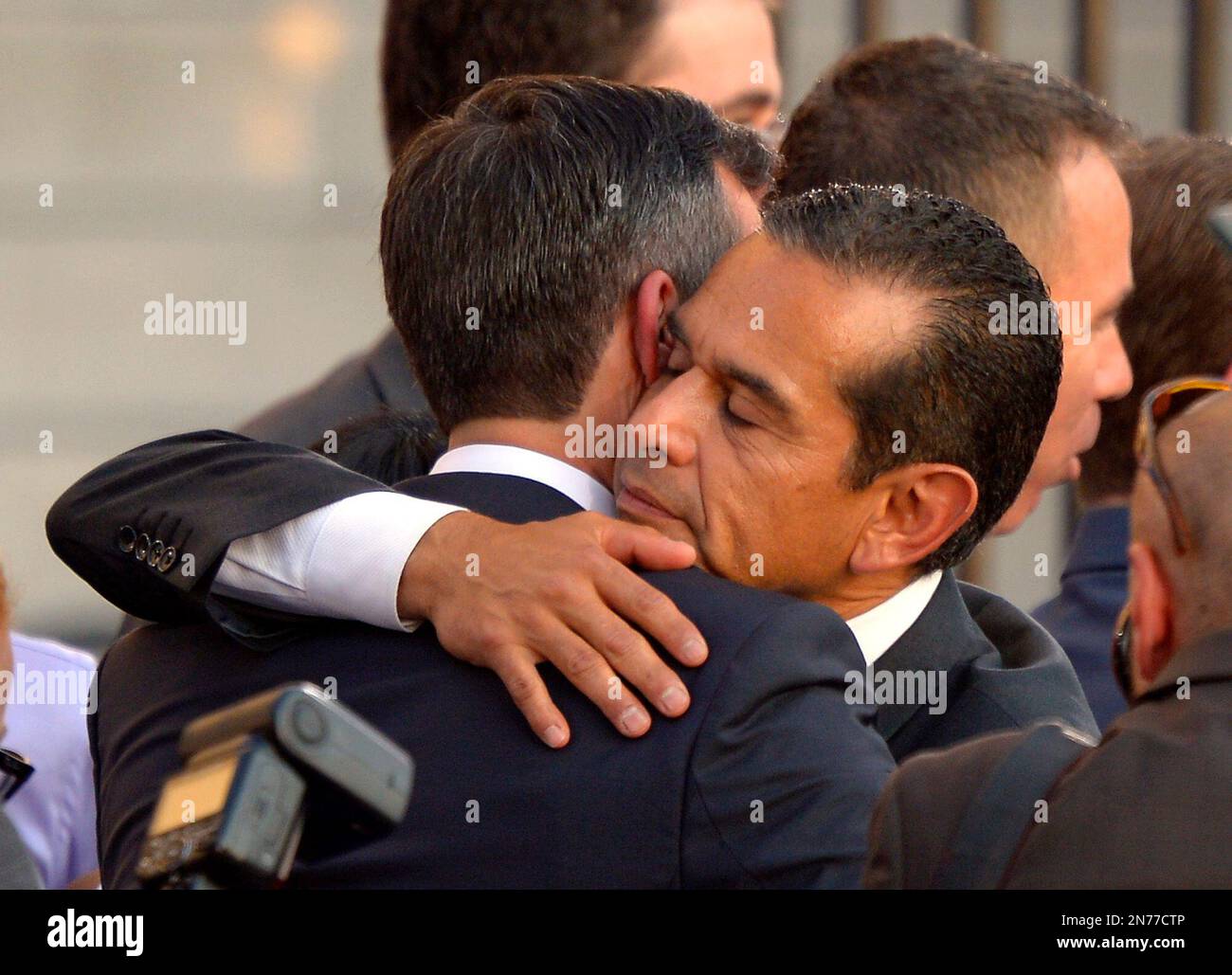 New Los Angeles Mayor Eric Garcetti, left, hugs outgoing mayor Antonio ...