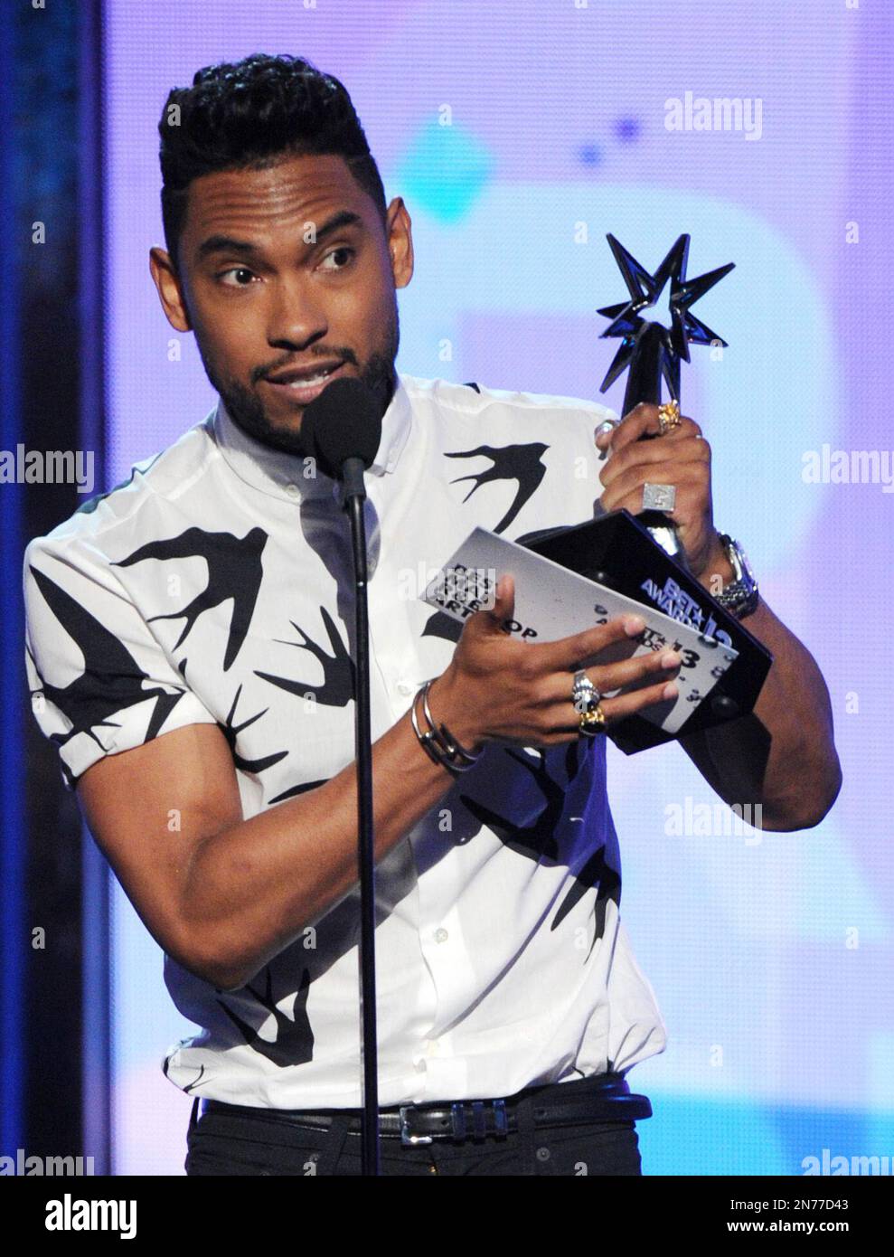 Miguel accepts the award for best male R&B/pop artist at the BET Awards ...