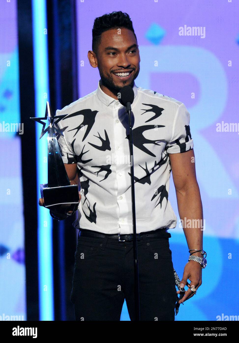 Miguel accepts the award for best male R&B/pop artist at the BET Awards ...