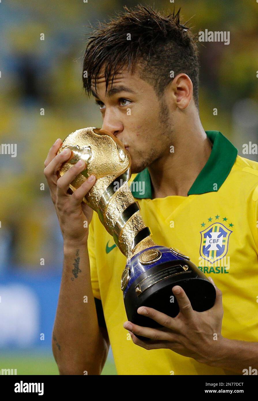 Brazil's Neymar kiss the trophy after the soccer Confederations Cup ...