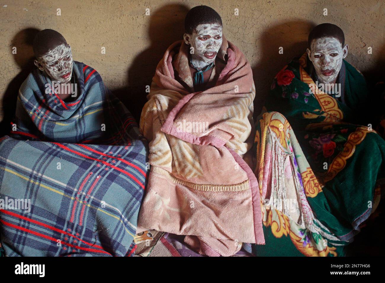 Xhosa boy's sing in a hut as they undergo traditional Xhosa male ...