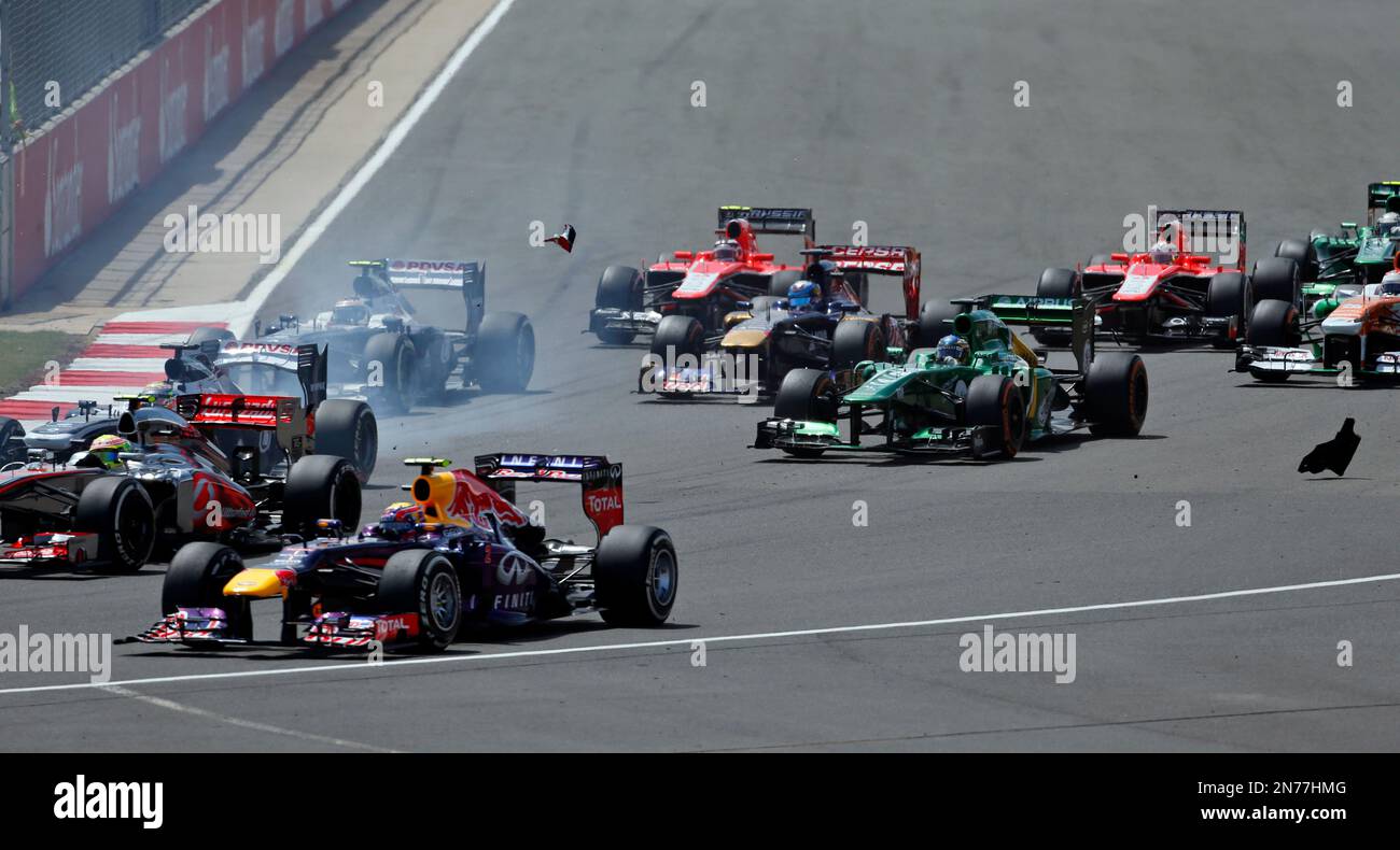 Debris from a car are spread in the circuit as the pack races into the ...