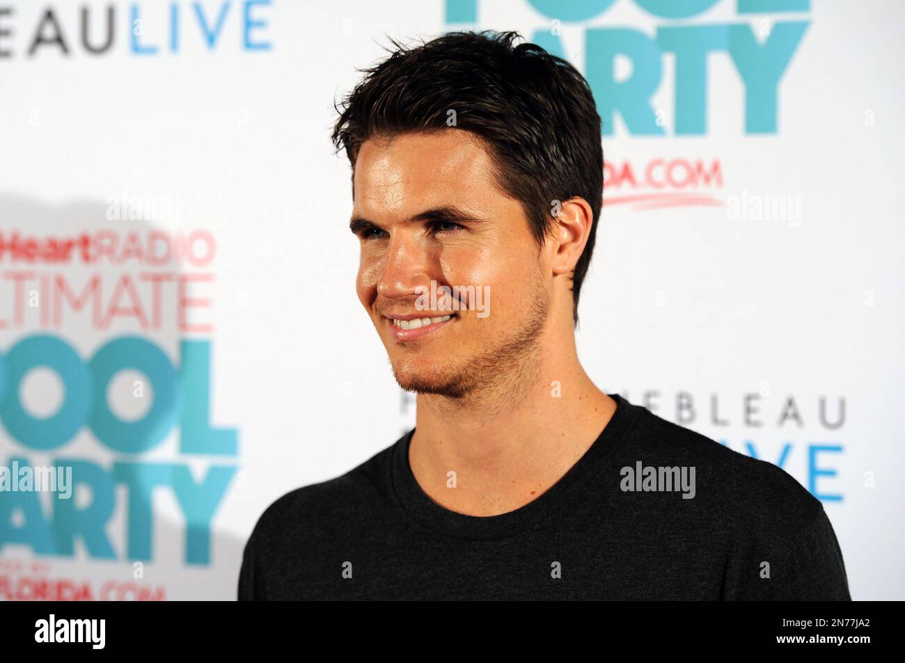 Robbie Amell arrives at the iHeartRadio Ultimate Pool Party at the ...