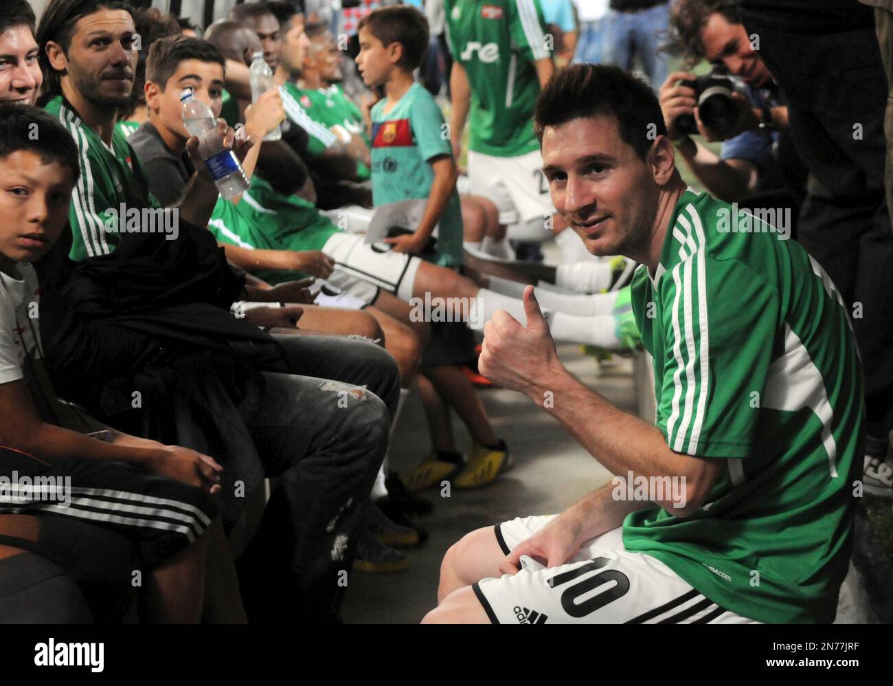 Argentina's Lionel Messi, right, gives a thumb-up during an exhibition ...