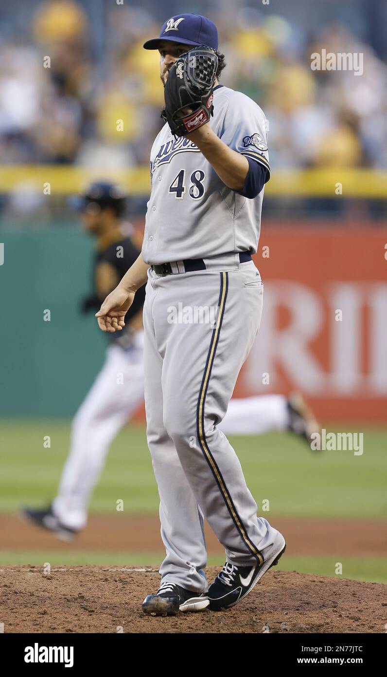 Pittsburgh Pirates' Garrett Jones trots behind Milwaukee Brewers ...