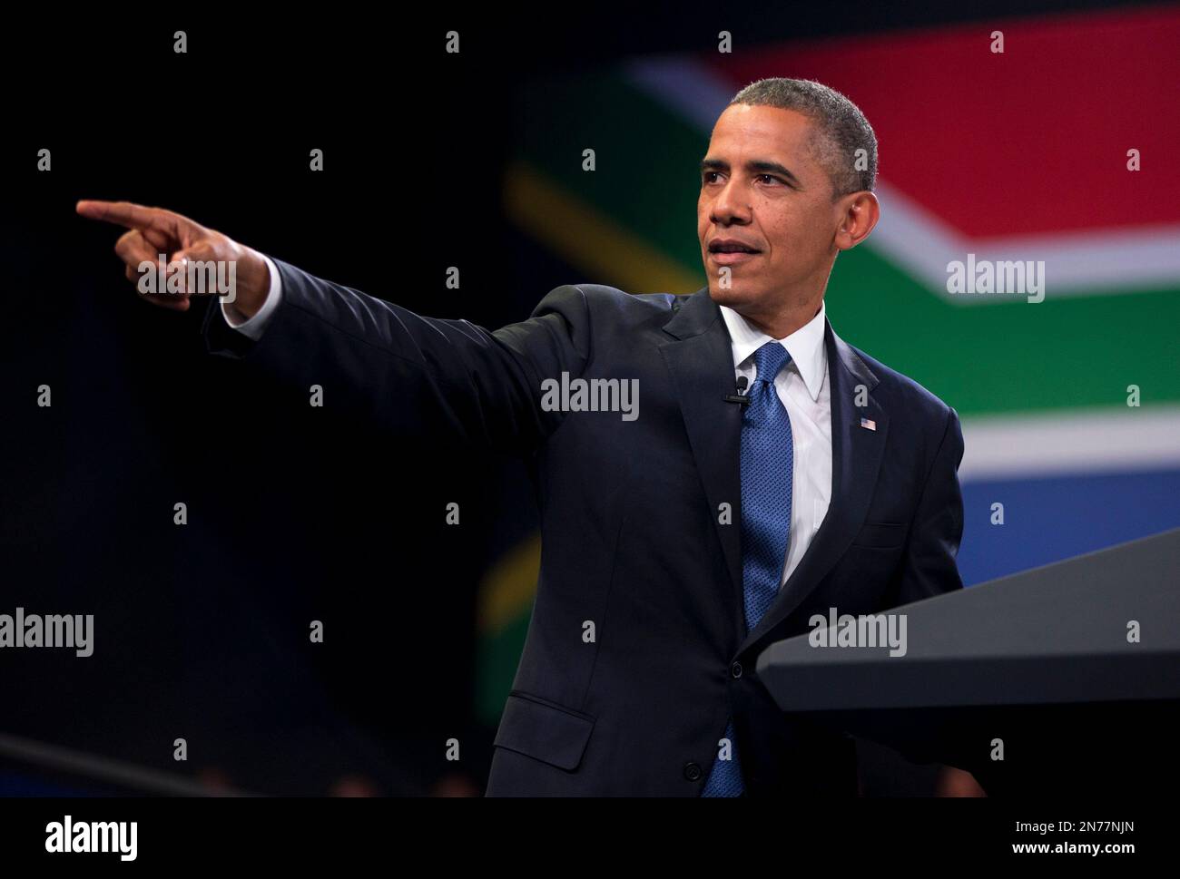 U.S. President Barack Obama gestures during a town hall meeting with ...