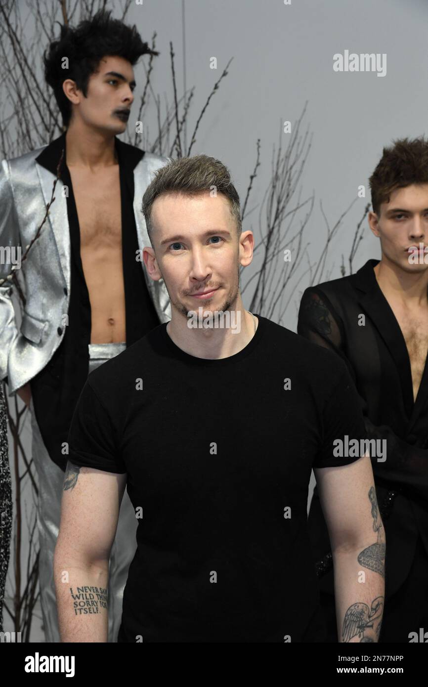Designer Stephen Mikhail poses infront of models wearing his designs ...