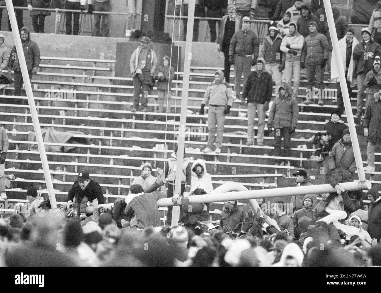 Several New England Patriots fans take down the goalposts at Sullivan ...