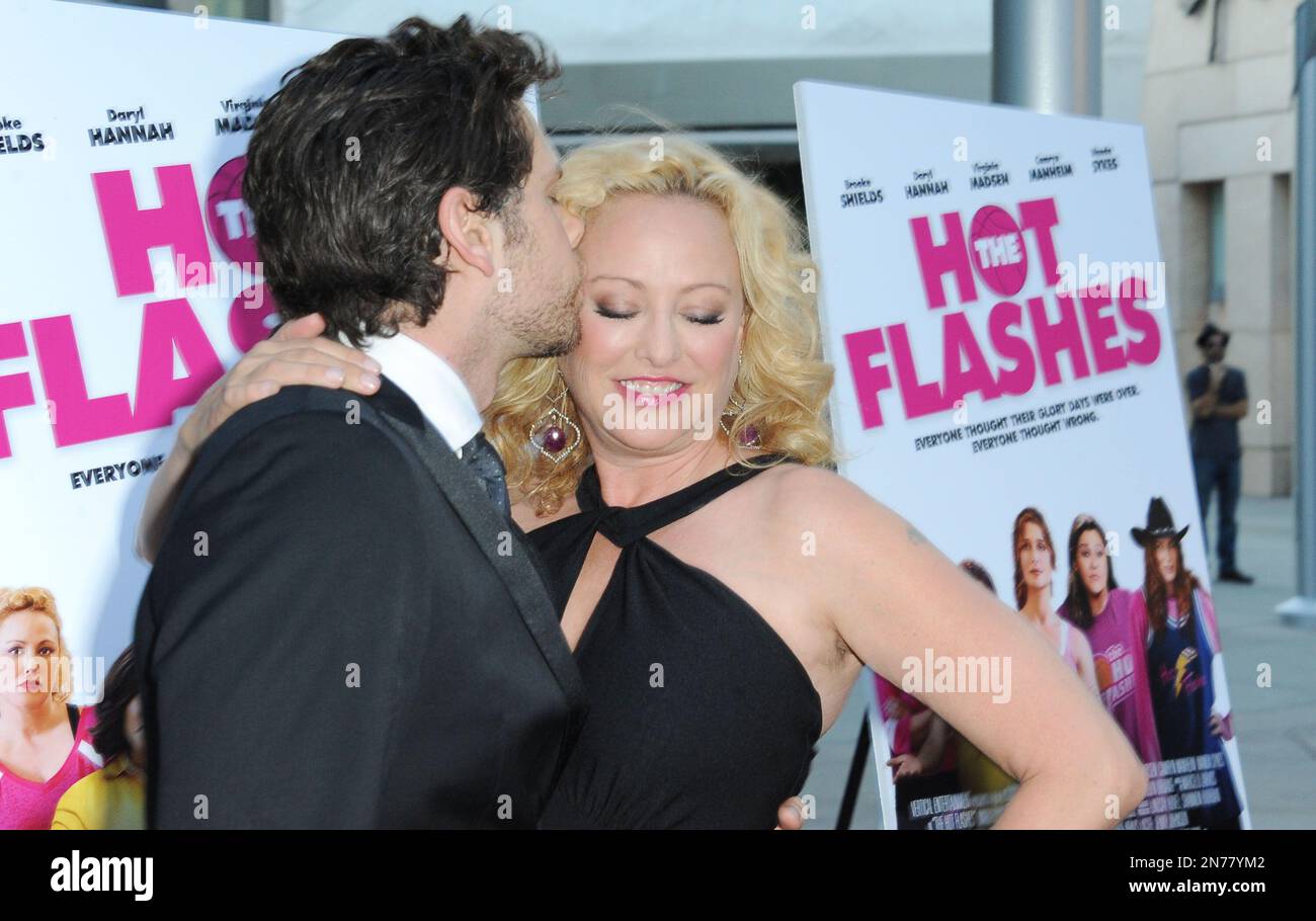 Virginia Madsen, at right, and Nick Holmes arrives at the LA premiere ...