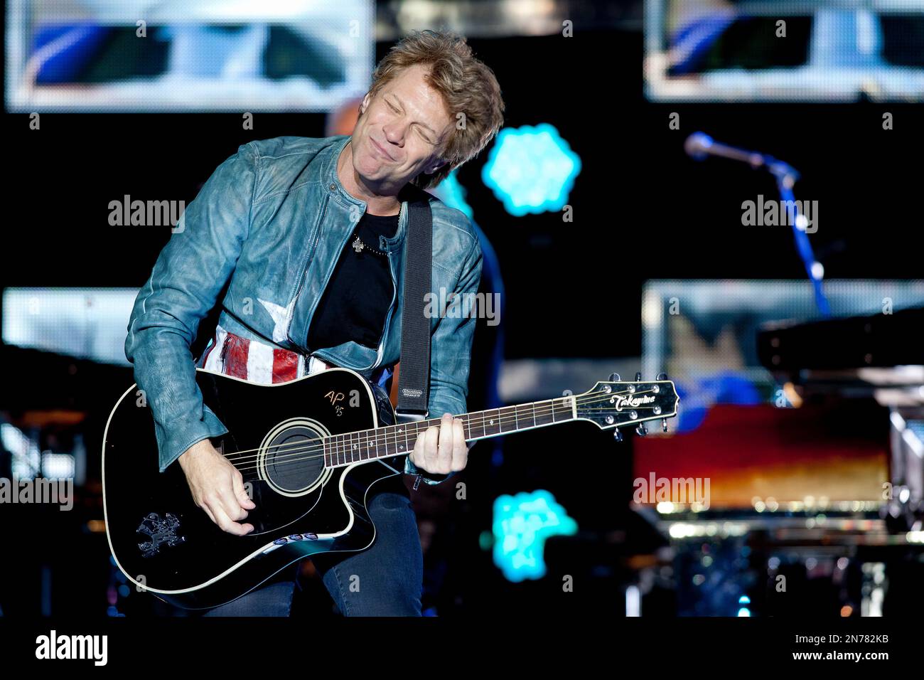 Singer Jon Bon Jovi play the guitar during a concert of the American ...