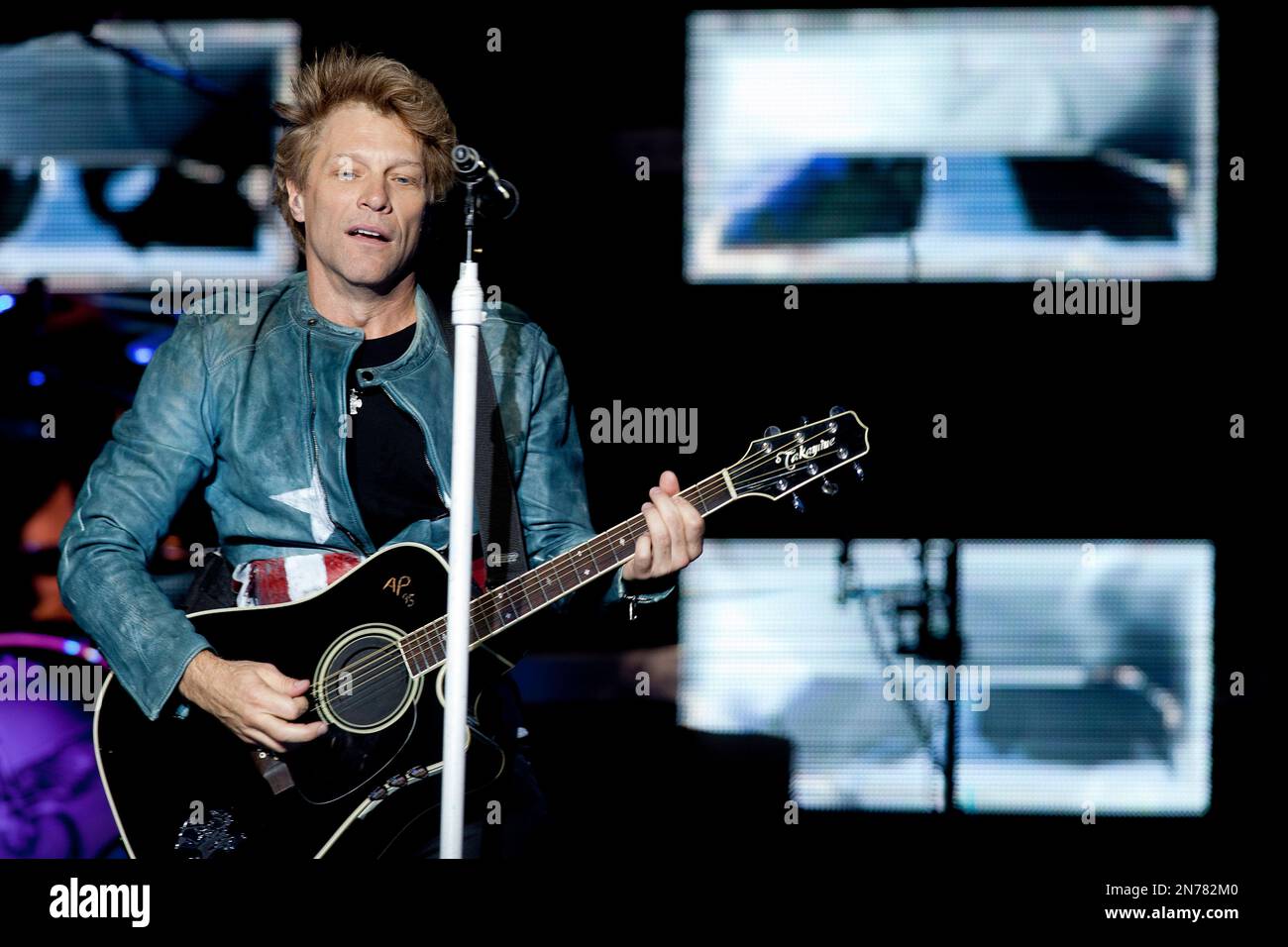Singer Jon Bon Jovi play the guitar during a concert of the American ...