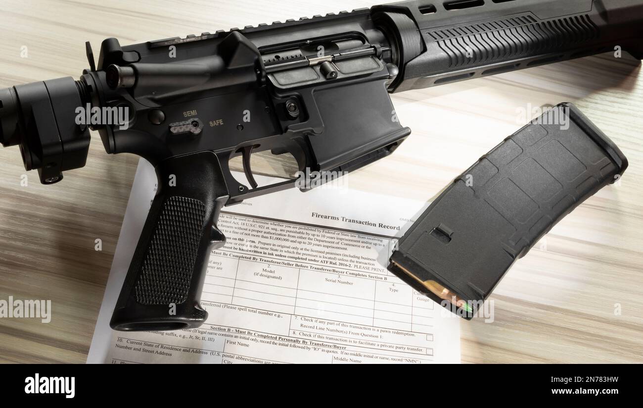 AR-15 and magazine with public domain FBI Background check form Stock ...