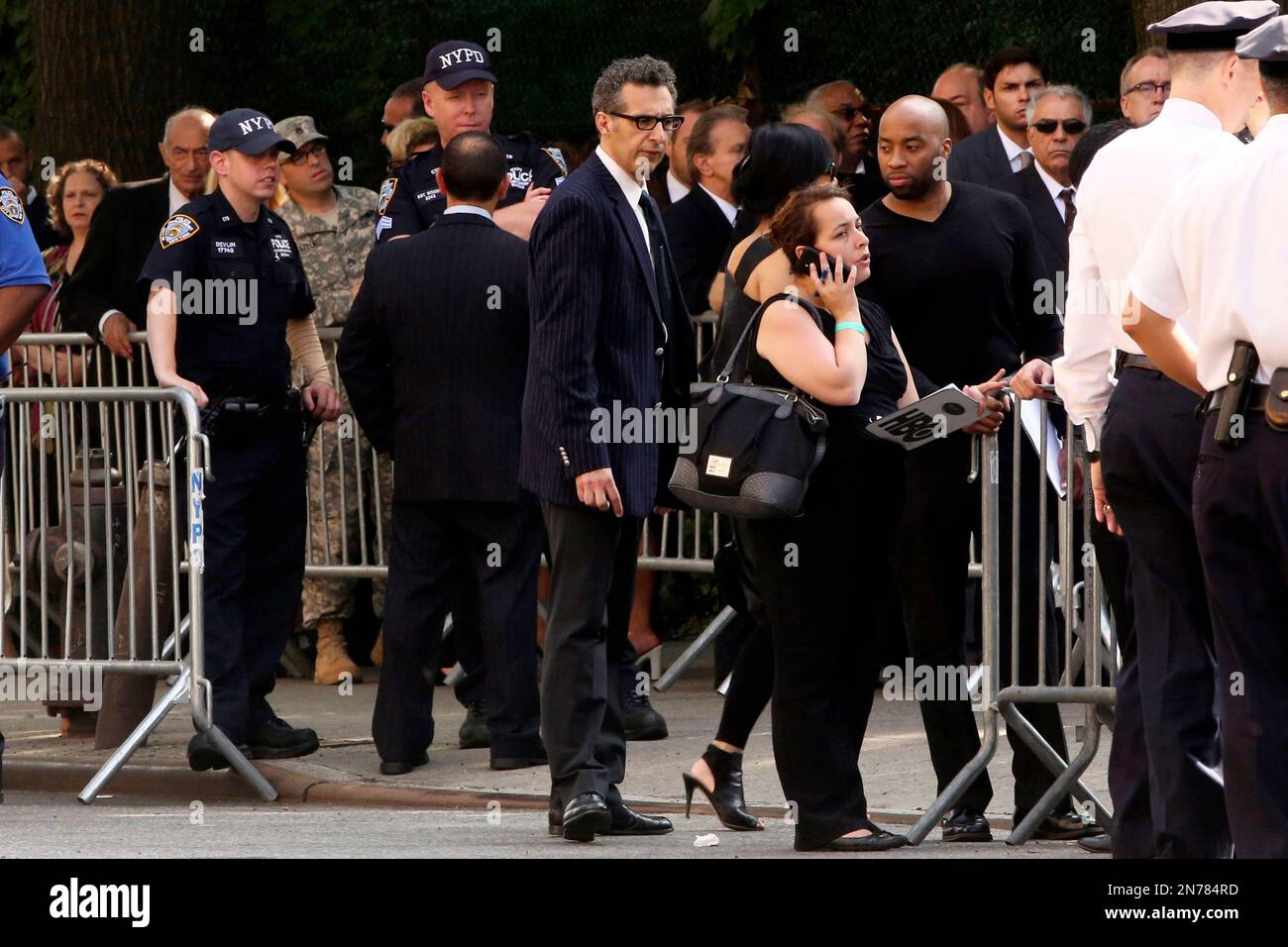 Actor John Turturro, center, arrives at the the Cathedral Church of ...