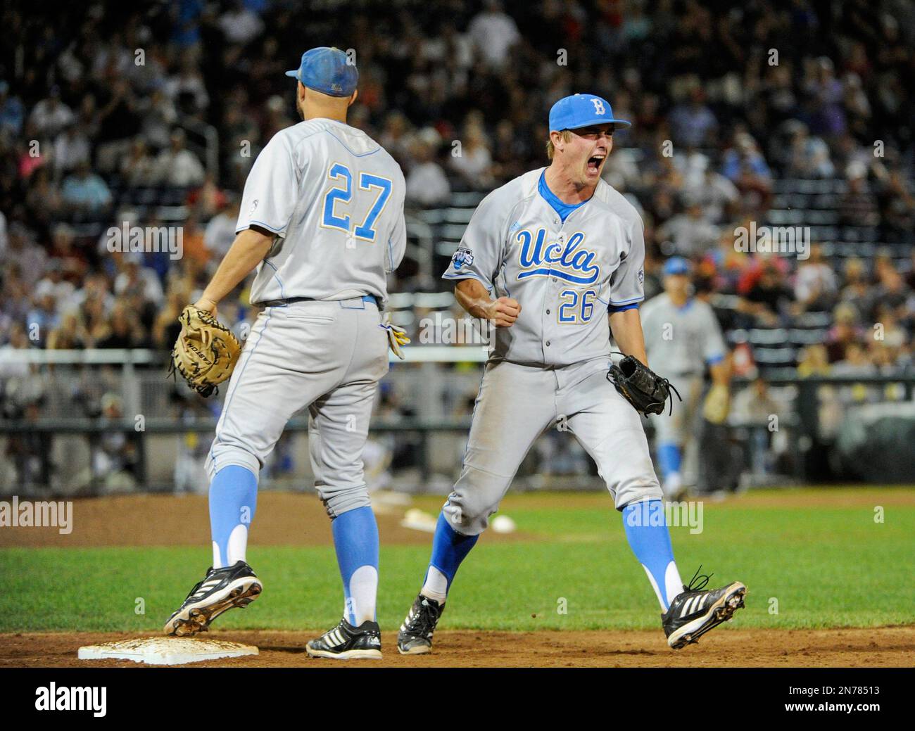 UCLA closing pitcher David Berg (26) reacts after the final out against ...